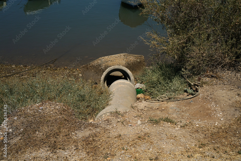 Drain pipe through which apparently clean water flows Stock Photo ...