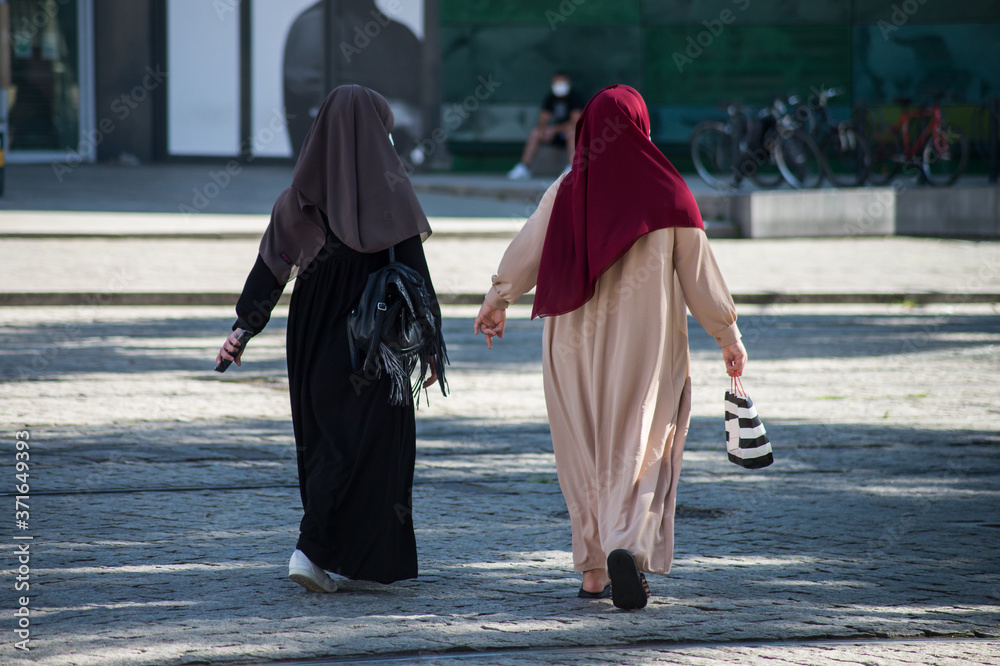 Portrait on back view of muslim women walking in the street Stock Photo ...