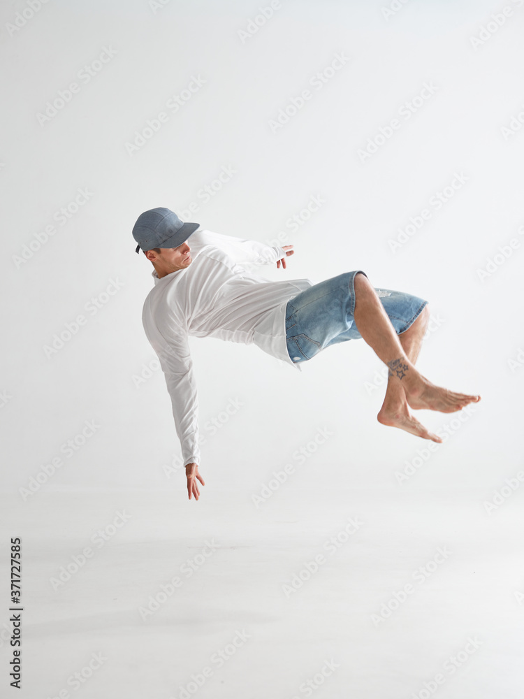 Cool stylish guy dancer levitating isolated on white background. Dance ...