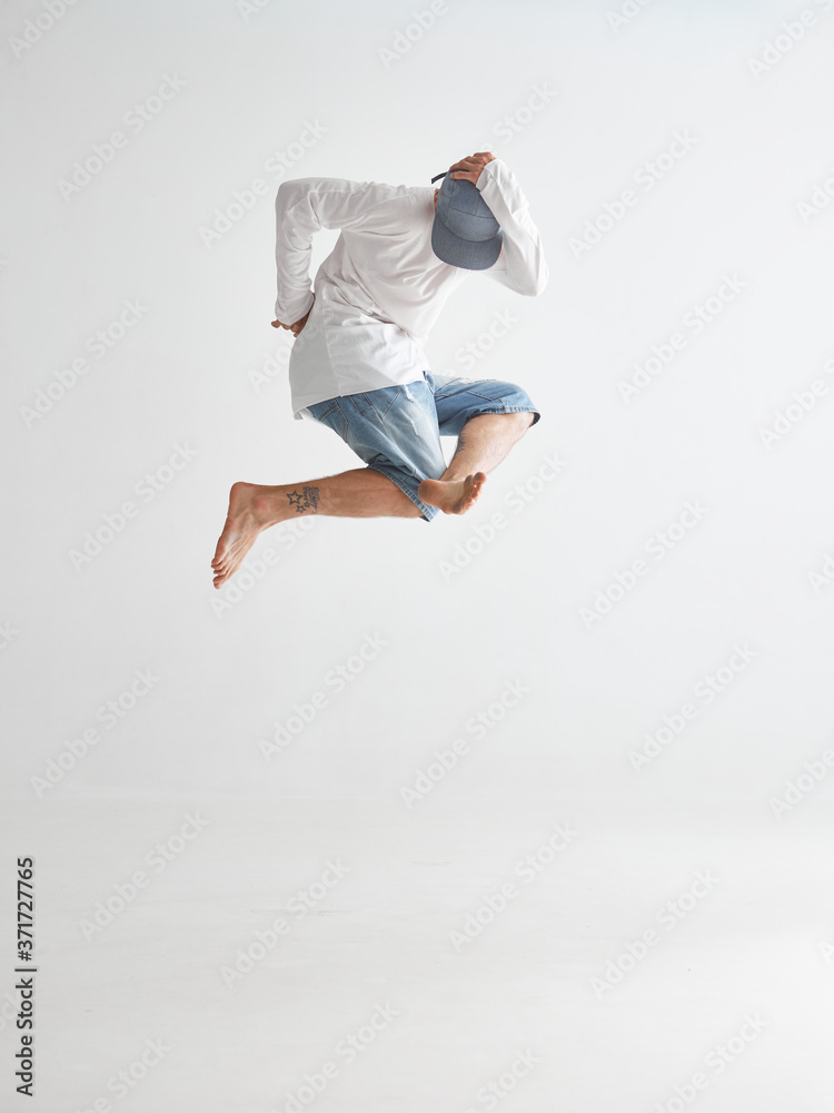 Cool stylish guy dancer levitating isolated on white background. Dance ...