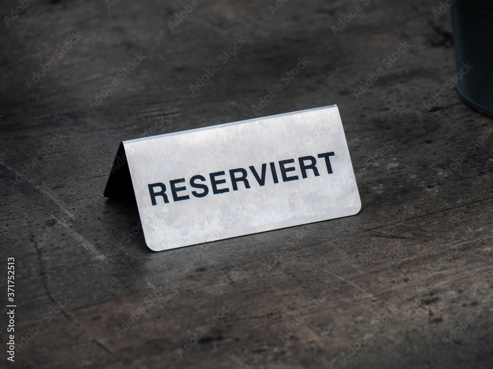 Foto de German "Reserved / germ. Reserviert" table sign on the ...