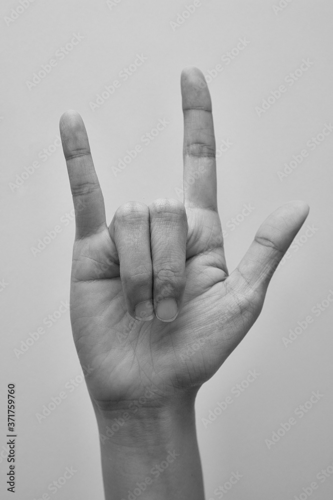 Female's hand doing sign language "I love you". isolated on white ...