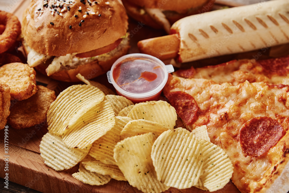 Unhealthy and junk food. Different types of fastfood and snacks on the ...