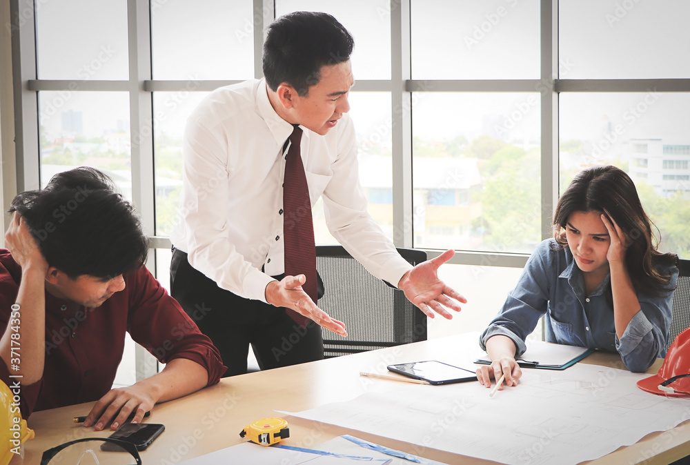 construction workers discussing about the project at office table ...