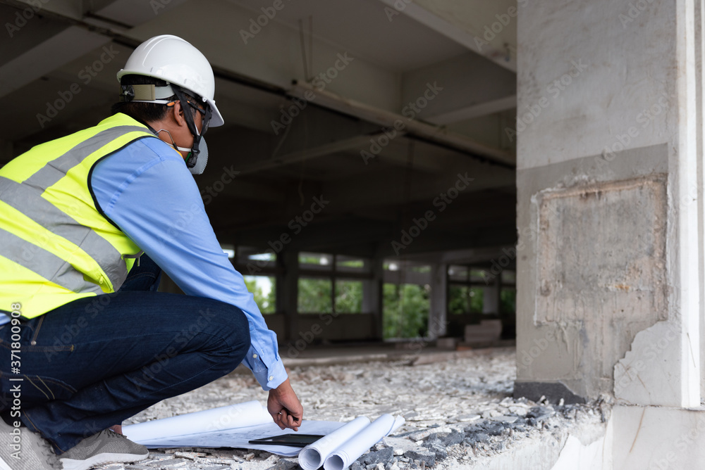 Civil Engineer People wearing face mask and safety helmet while looking ...