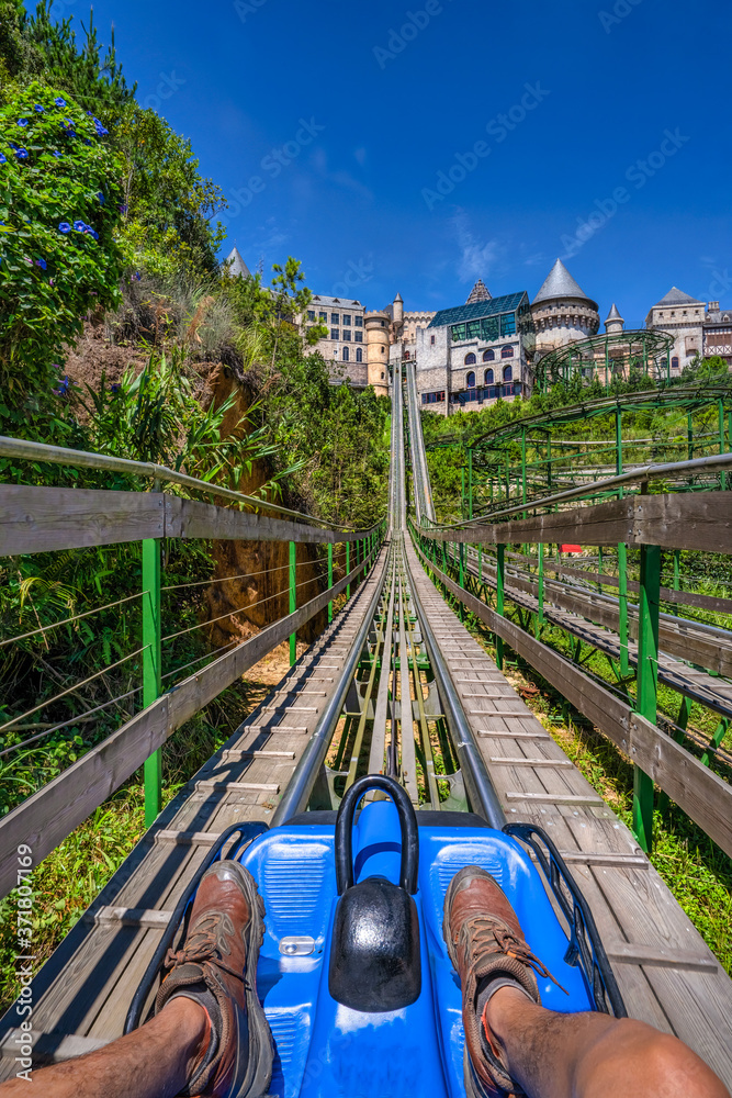 Aerial view of alpine coaster the Golden Bridge is lifted by two giant ...