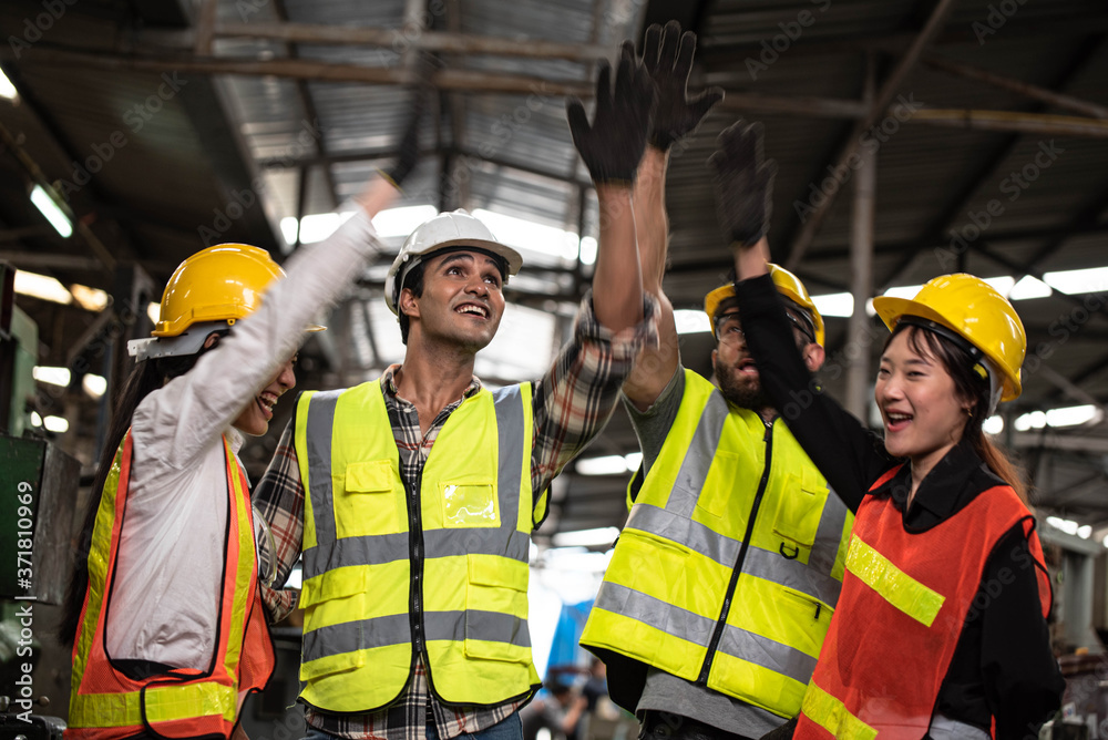 Technicians and Engineer workers with hardhat or helmet, vest showing ...