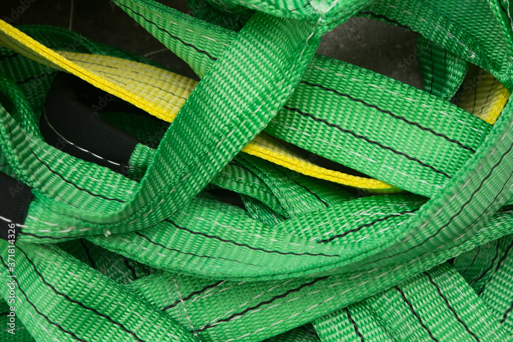 Industrial sewing machine sews a webbing sling. Manufacture of textile ...