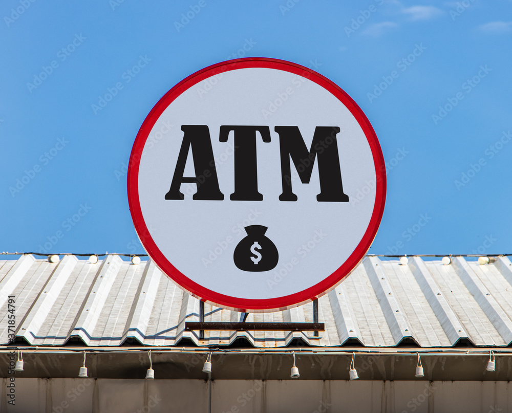 Fotografia do Stock: A Circle billboard with icon an ATM is installed ...