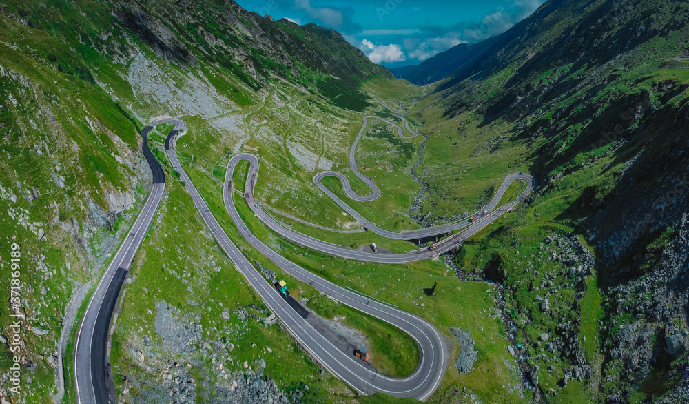 Epic winding road on Transfagarasan pass in Romania in summer time ...