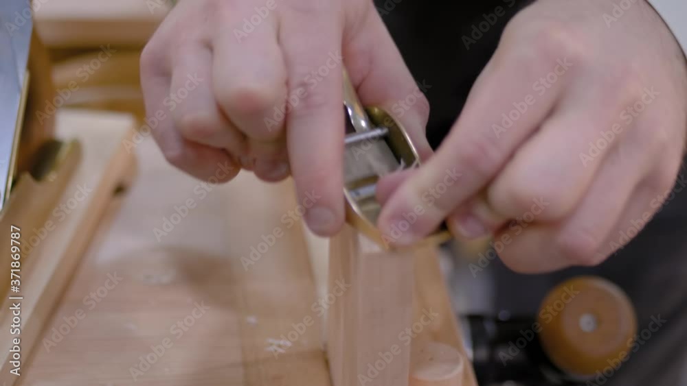 Slow motion - professional man carpenter using vintage spokeshave or ...