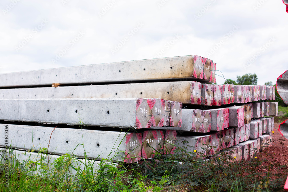 Front and side view of concrete pole pile on ground. Red mark at the ...