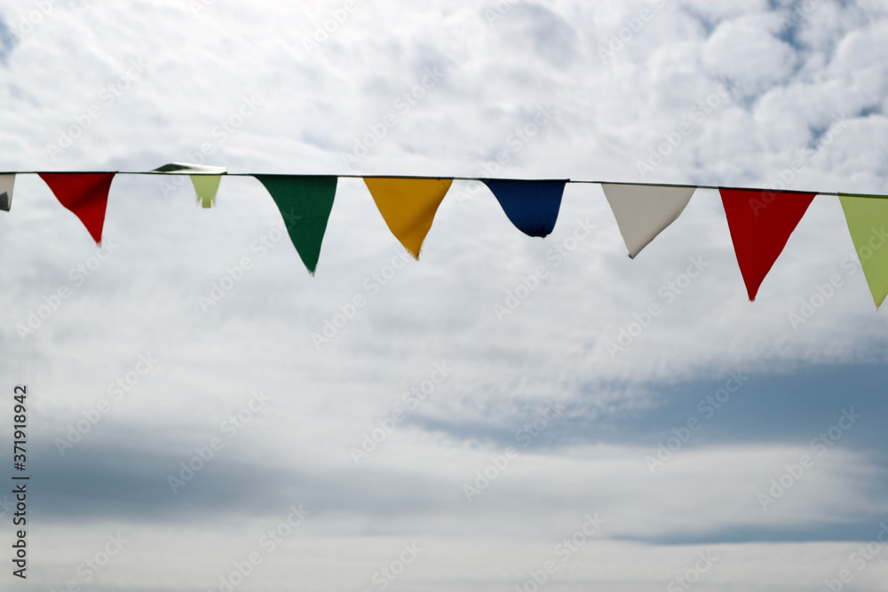 colorful small flags fluttering in the wind on the sky background Stock ...