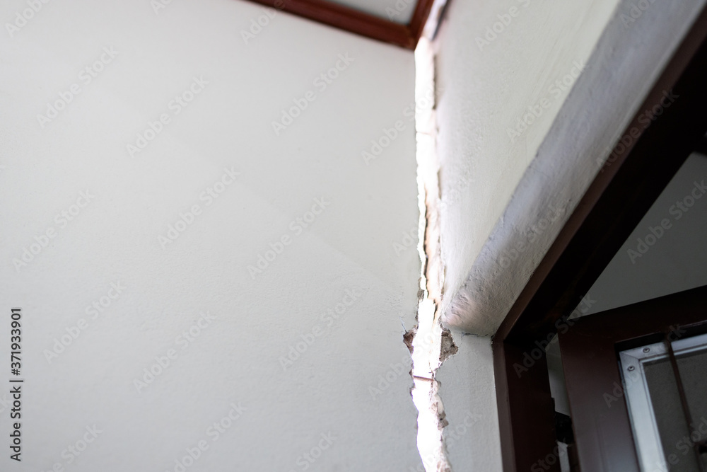 The cracked cement wall texture in the house,cracking separation of the ...