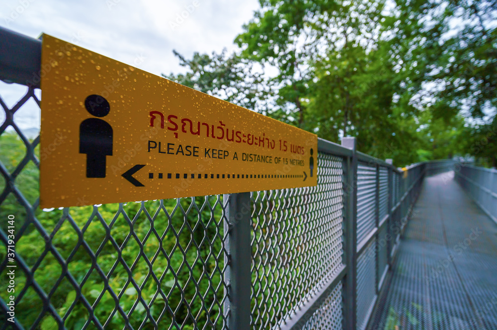 Keep distance information sign on Canopy Walkway register informing ...