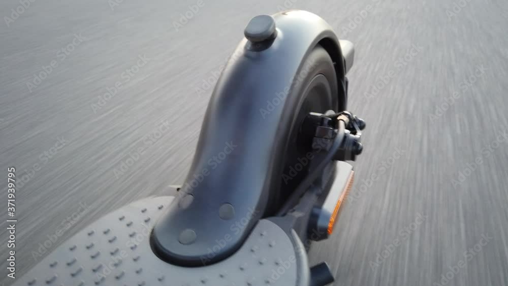 Start and drive from an environmentally friendly e-scooter rear wheel ...