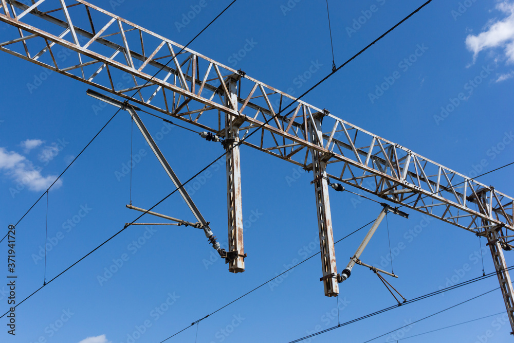 Railway electrification system. Power line wire over rail track. High ...