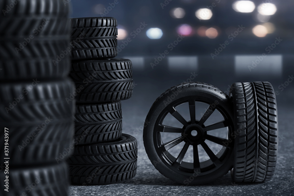 Car tires on the street Stock Photo | Adobe Stock