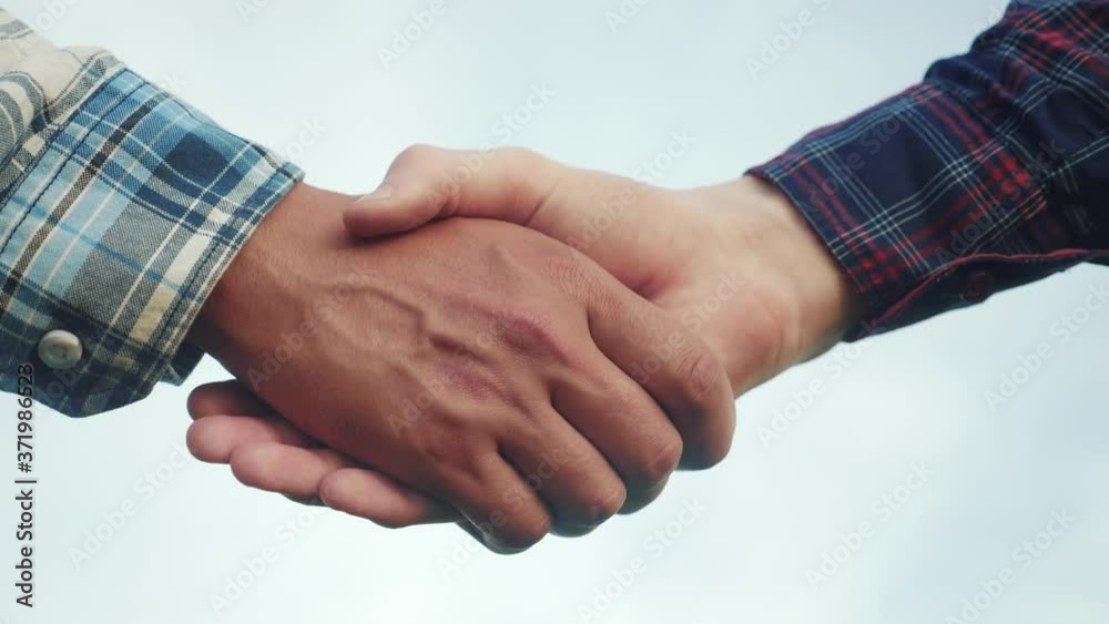 teamwork handshake concept. two people shake hands shaking hands ...