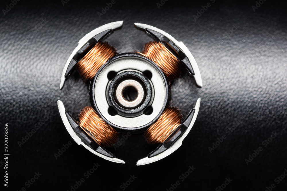 Dc motor rotor from the mini motor on black texture background Stock ...