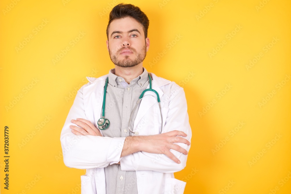 Portrait of serious handsome doctor man feels cool and confident ...