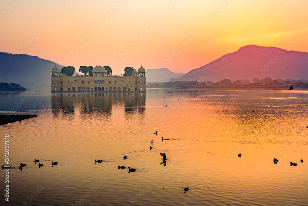 Panoramic view during Sunrise at the Jal Mahal 'Water Palace'. It is an ...