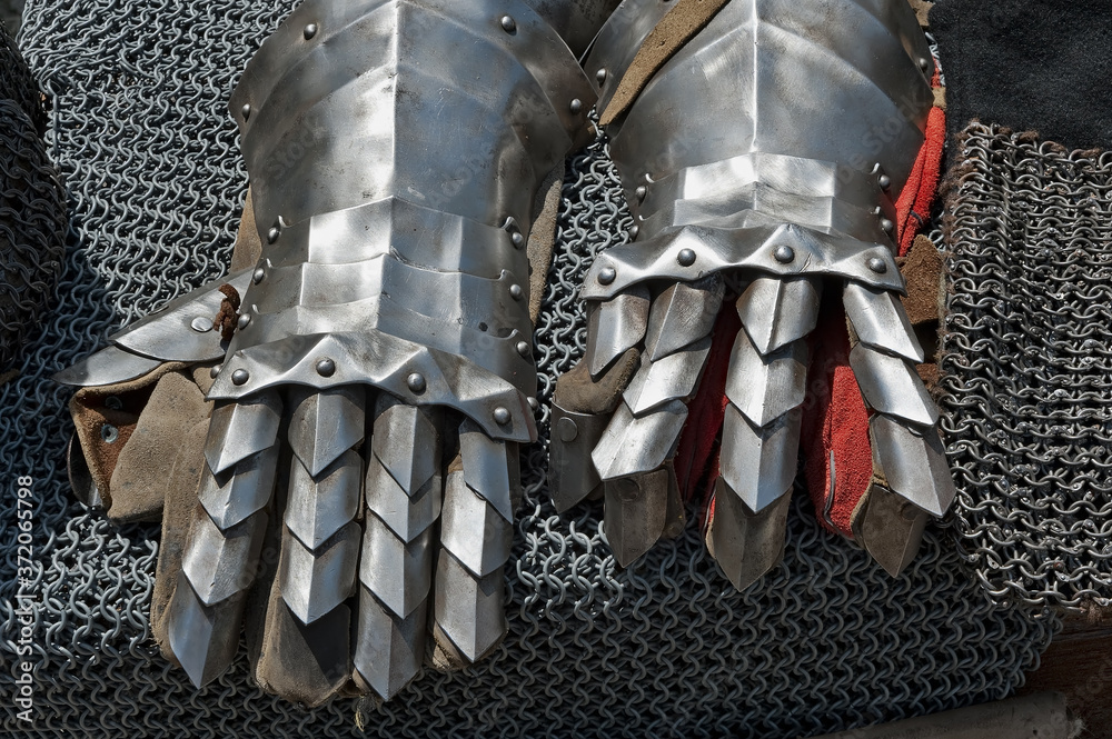 Gauntlets on mail background Stock Photo | Adobe Stock