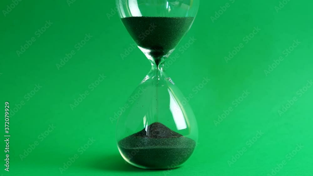 Stockvideo Shot of a sand clock measuring time while the sand is ...