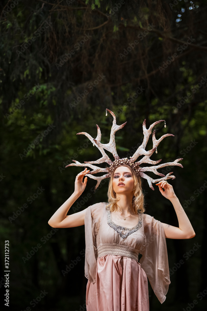 Beautiful Caucasian Girl With Artistic Deer Horns In Forest. Posing in ...