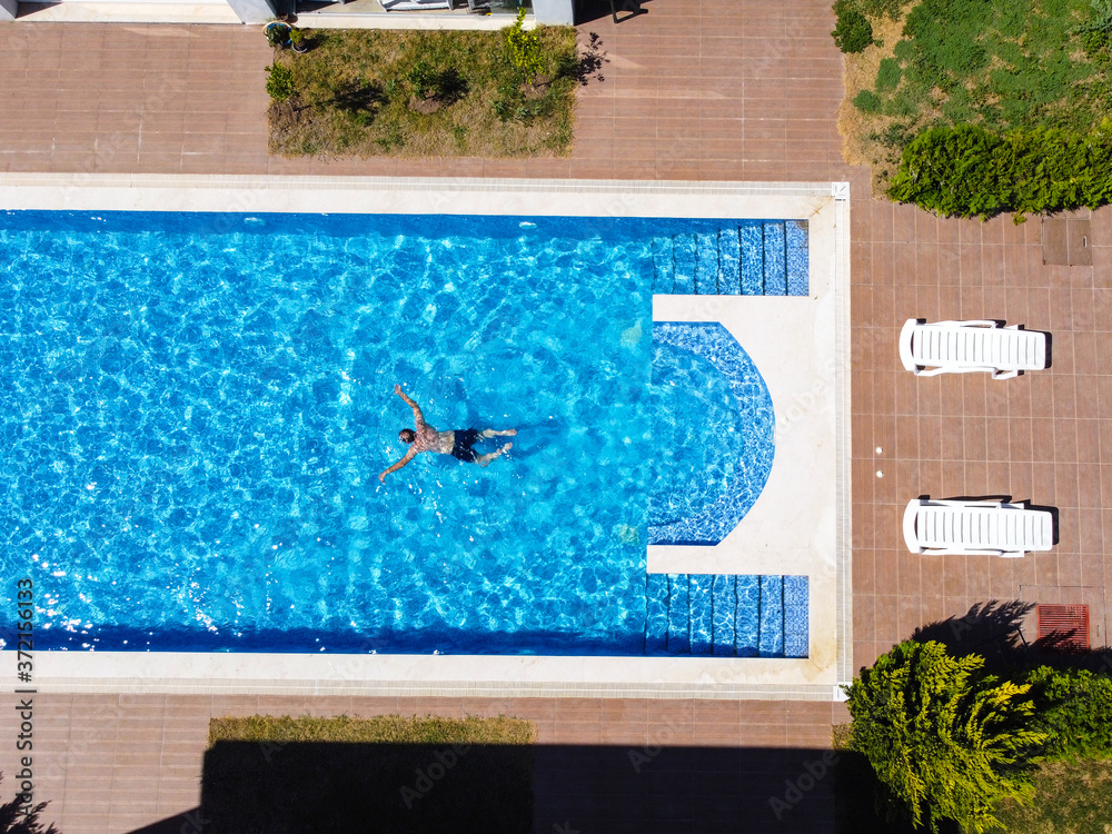 man swimming in the pool top down view Stock Photo | Adobe Stock