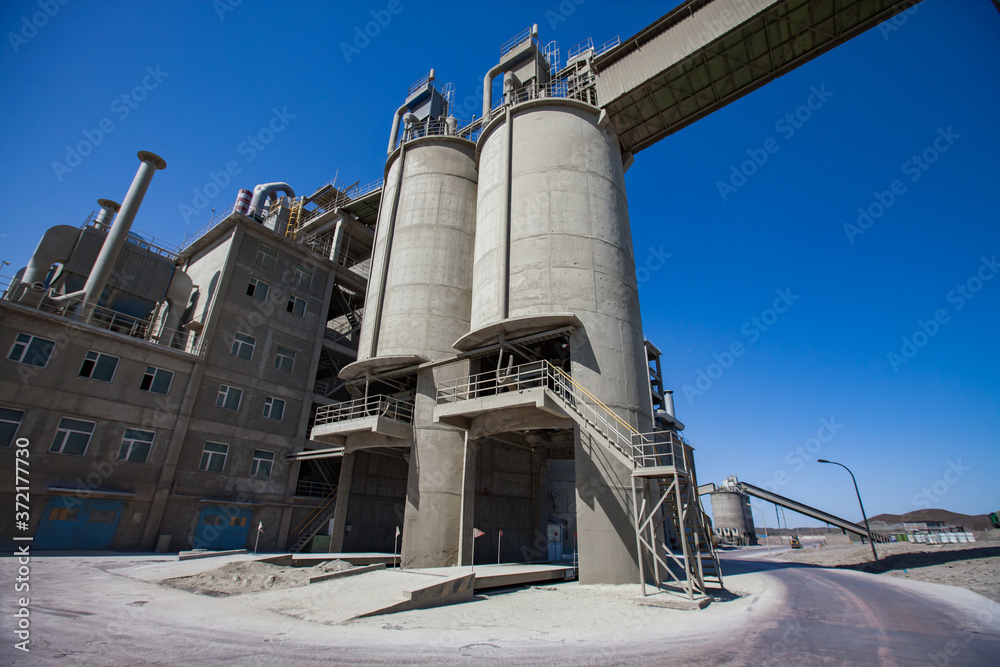 Mynaral/Kazakhstan: Modern cement plant in desert. Cement silos (tower ...