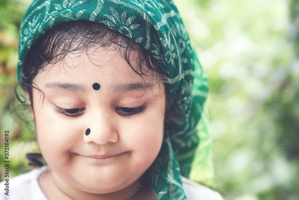 Cute Indian baby girl with traditional Indian dress with bindi on her ...