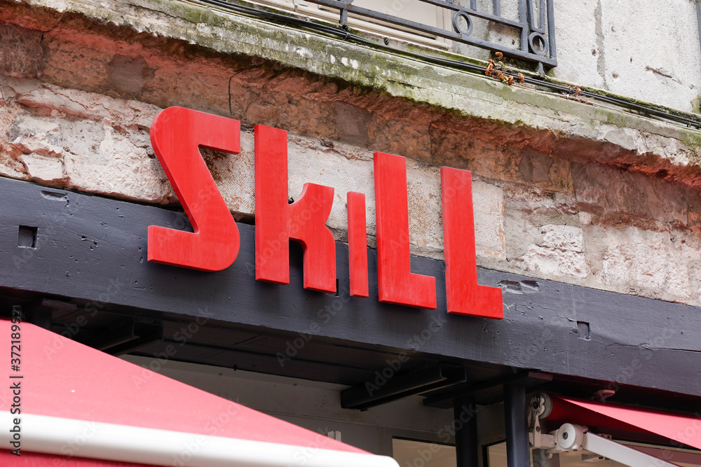 Foto de skill sign and text logo front of brand shop shoes and store ...