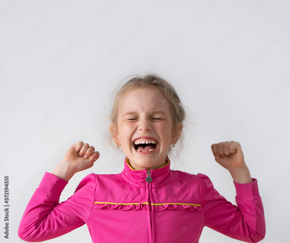 Little girl preschooler screaming with anger shutting tightly her eyes ...