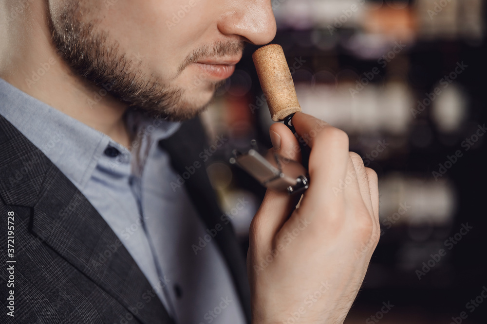 Smell of wine cork in hands of sommelier, sample aging drink Stock ...