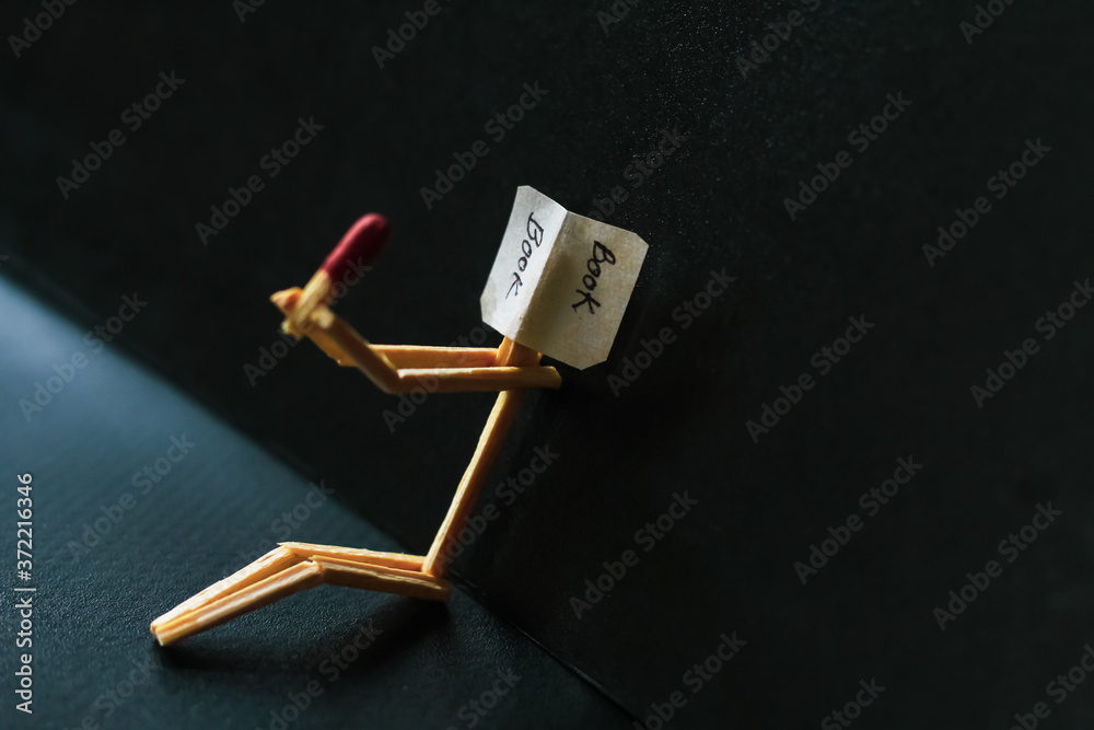 Fotografia do Stock: Matchstick concept and ideas. Book reading concept ...