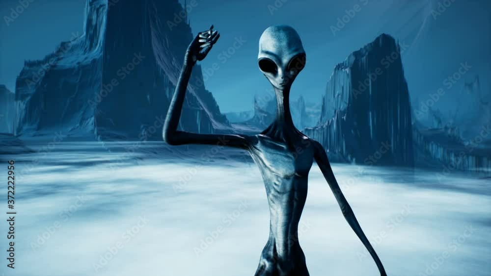 The alien makes an accusing and threatening gesture pointing his index ...