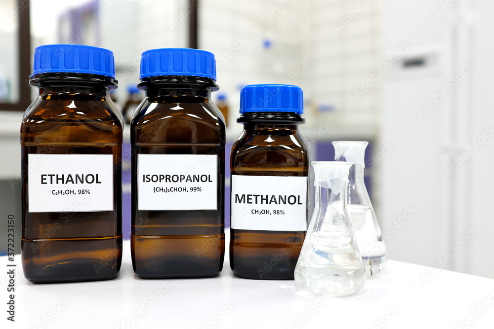 Selective focus of ethanol, methanol and isopropanol brown amber glass ...