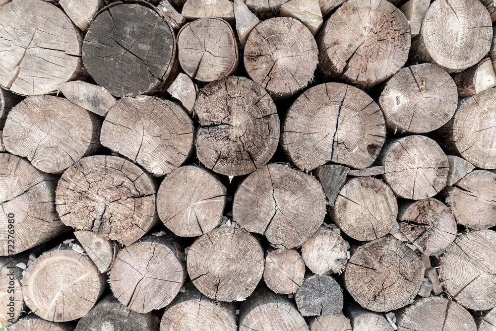 Folded stack, pile of wooden sawn logs with cross section of the timber ...