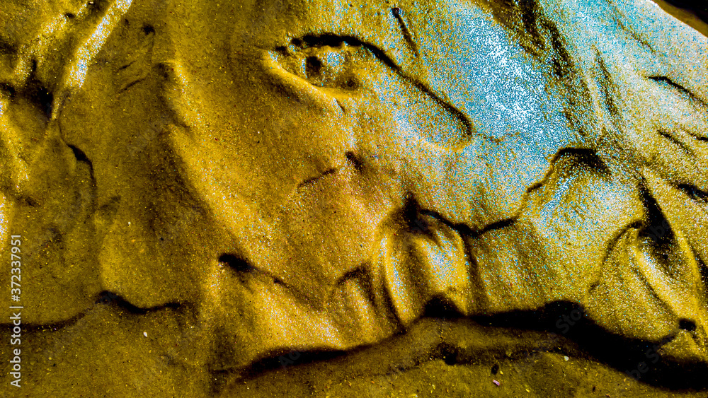 Footprint. Abstract sculpture in natural sand, created by the flow of ...