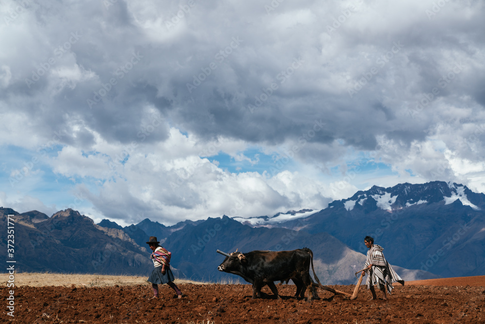 Indigenous couple farming with old tools Stock Photo | Adobe Stock