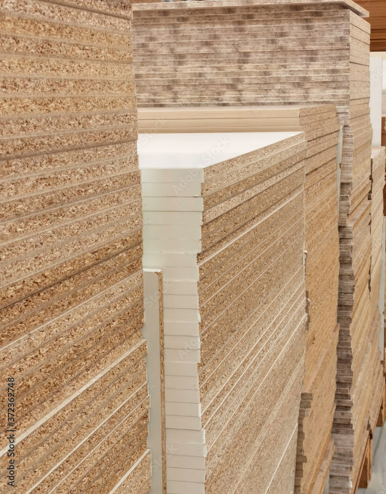 Folded wooden lining in a sawmill. Piled alder boards as texture Stock ...