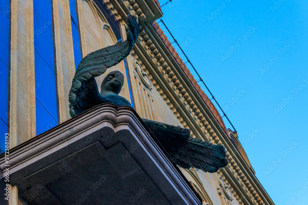 Statue of eagle on a wall of building on the Shota Rustaveli Avenue in ...
