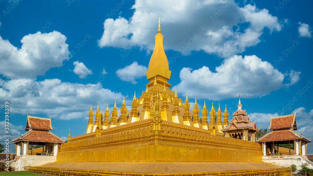 Photo & Art Print Pha That Luang is gold large Buddhist stupa and the most important national ...