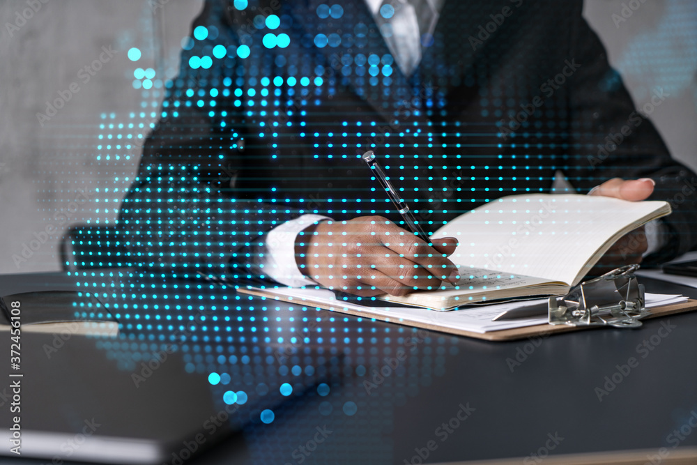 Planet earth map hologram and a woman taking notes. International ...