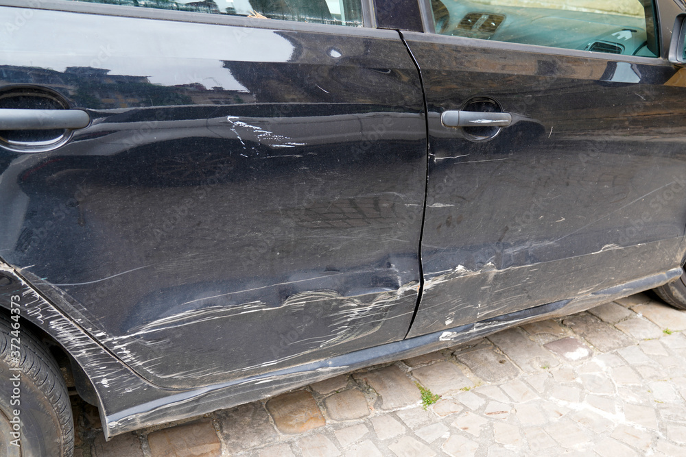 Car side is scratched and scraped with deep damage on accident to the ...