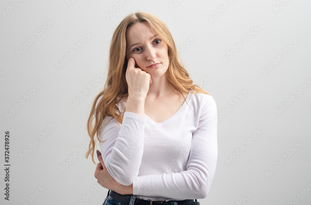 young bored woman posing on white background in studio Stock Photo ...