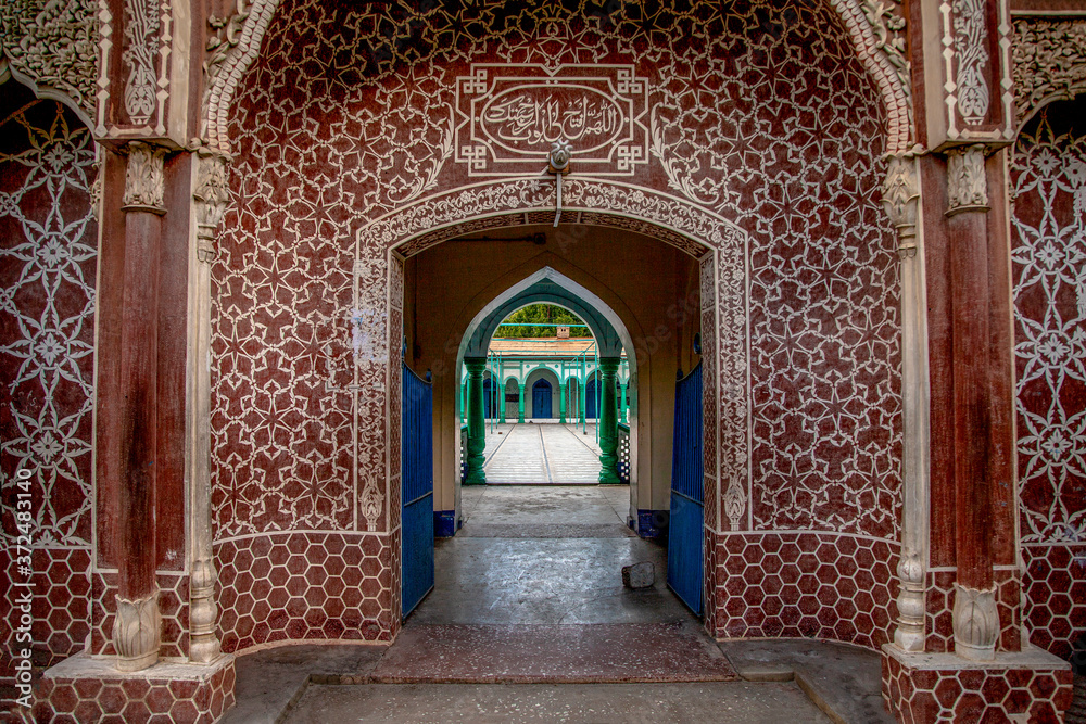 old historical main gate of an old building, fort and royal mosque in ...