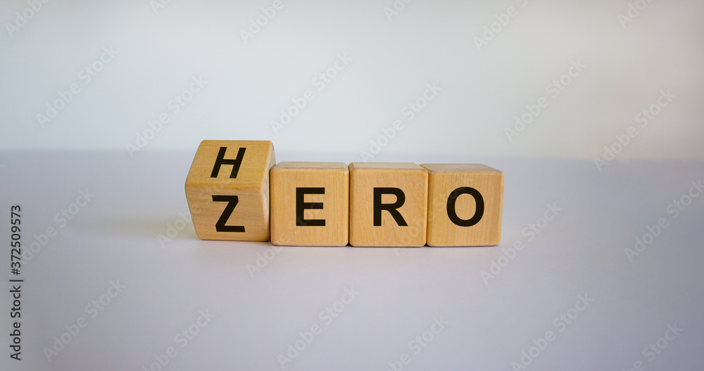 From zero to hero concept. Hand turns a cube and changes the word 'zero ...