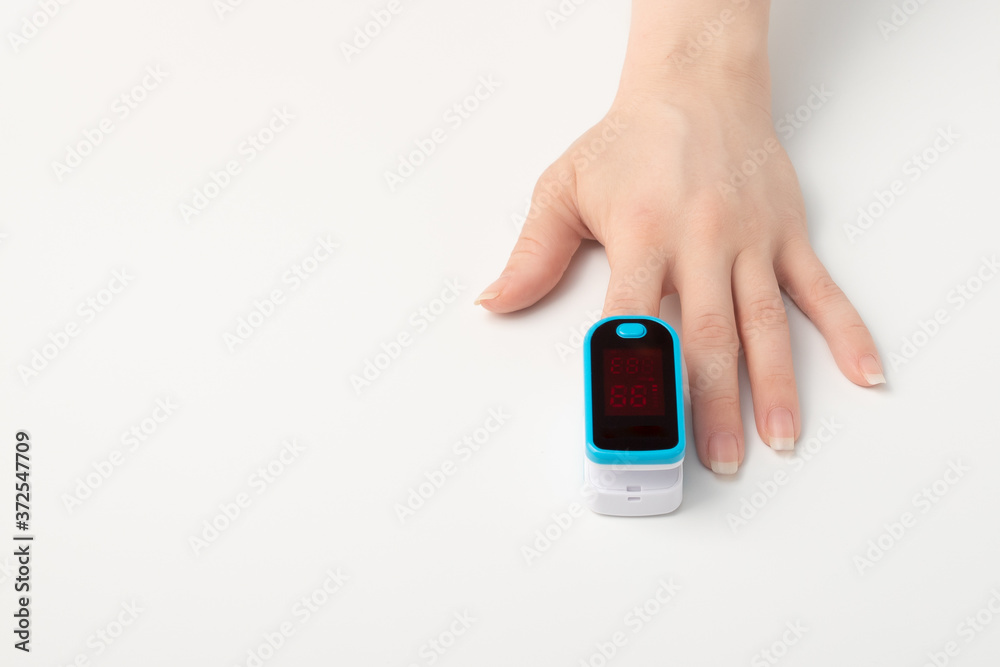 Assessment of the function of the respiratory system. Female finger in ...